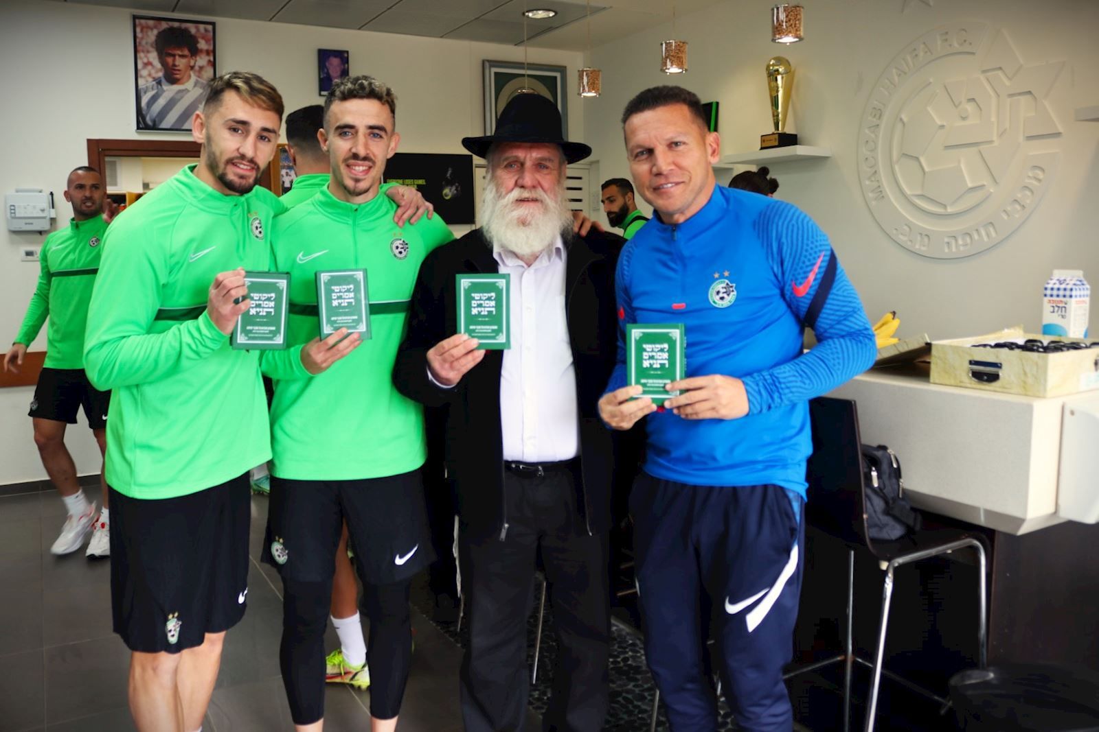 When Adar enters the locker room in Kfar Galim